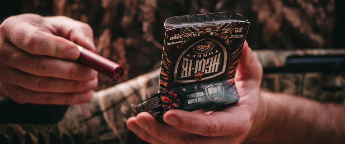 shotshell being removed from a box of HEVI-18